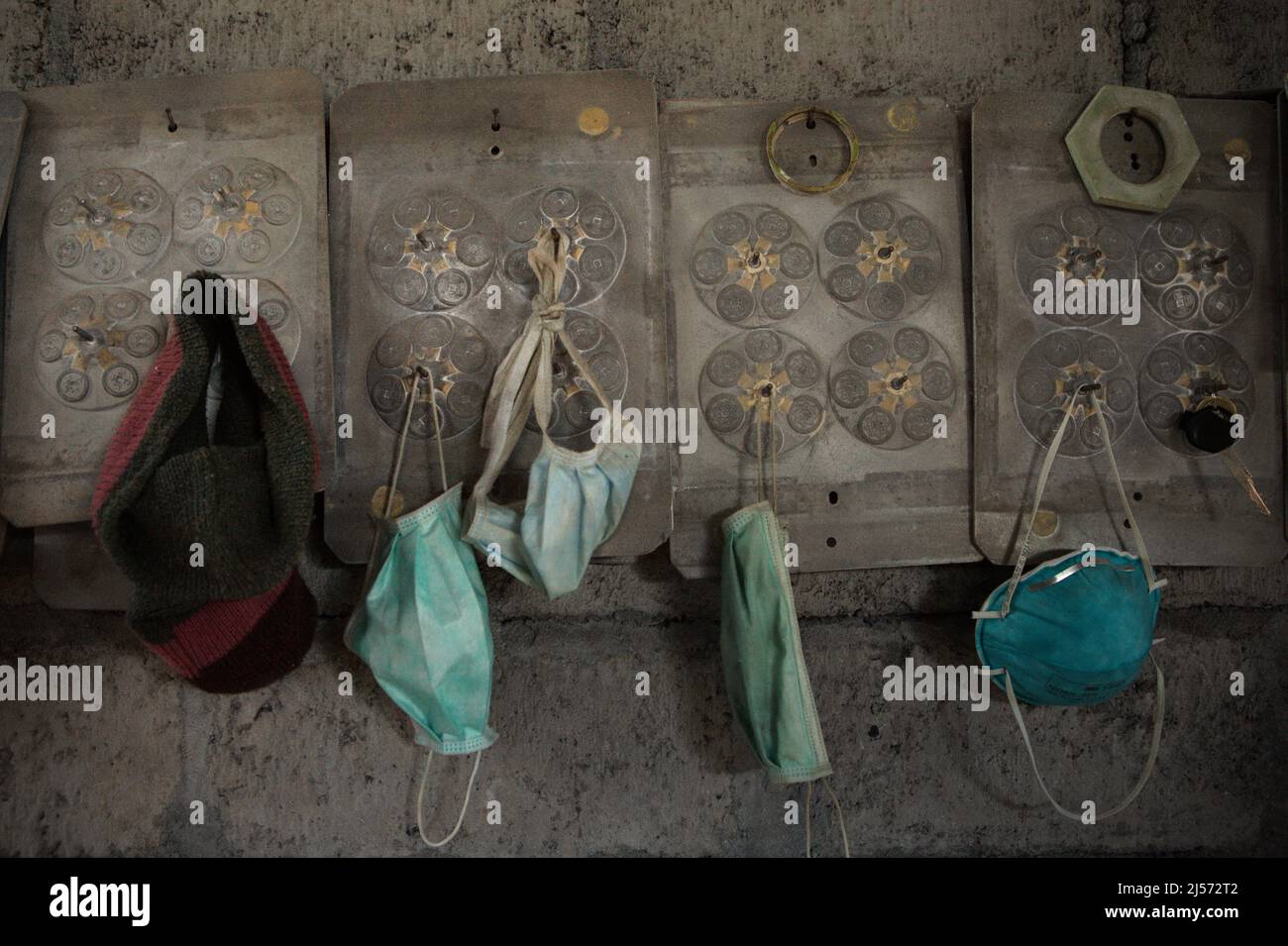 Face masks and a balaclava are hung on the wall, as seen during the ...