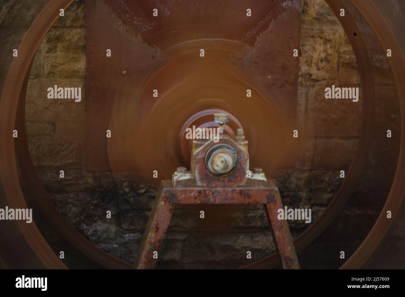 The part of mill wheel rotates under a stream of water, open air museum ...