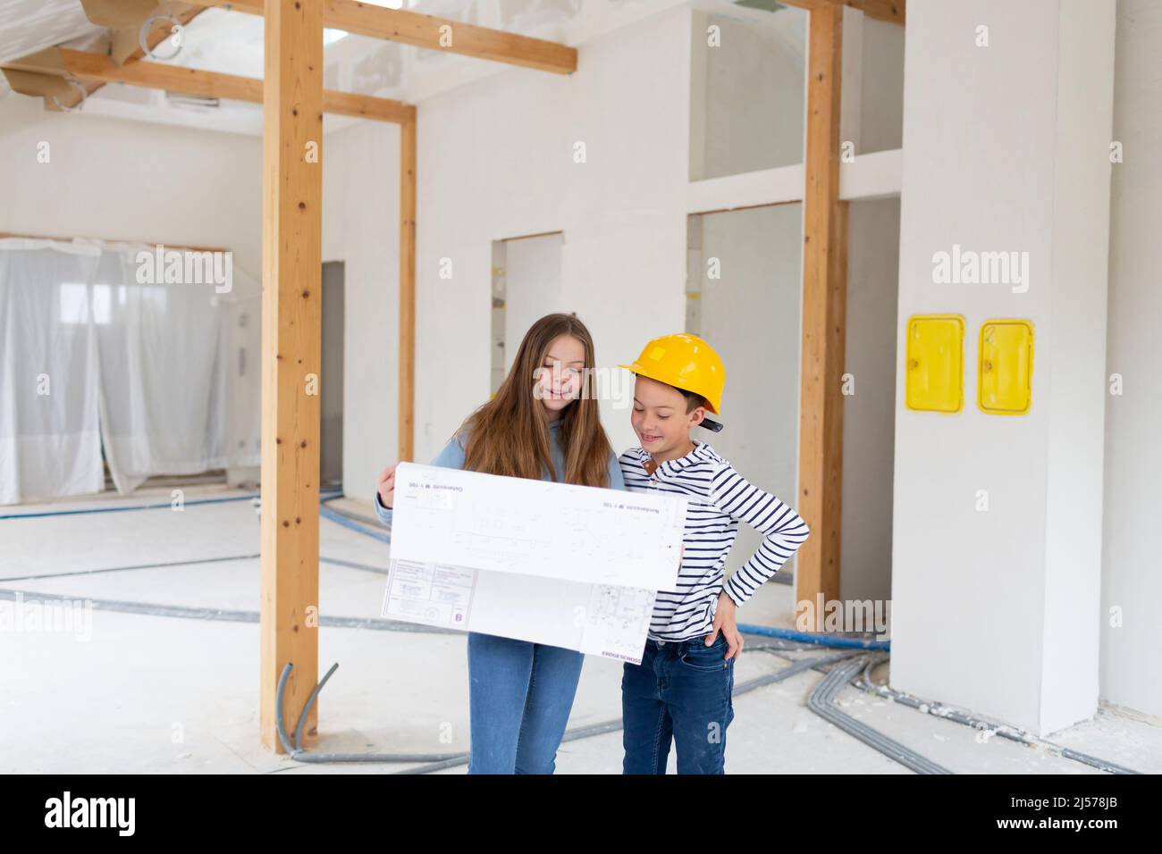 Brother and sister are on the construction site of their new room loft ...