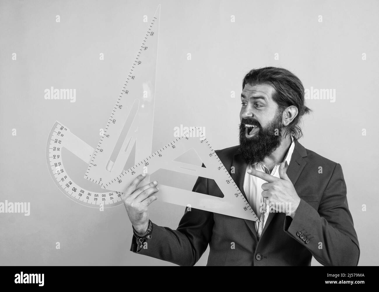 Measure And Size Happy Mature Teacher Holding Triangle And Protractor