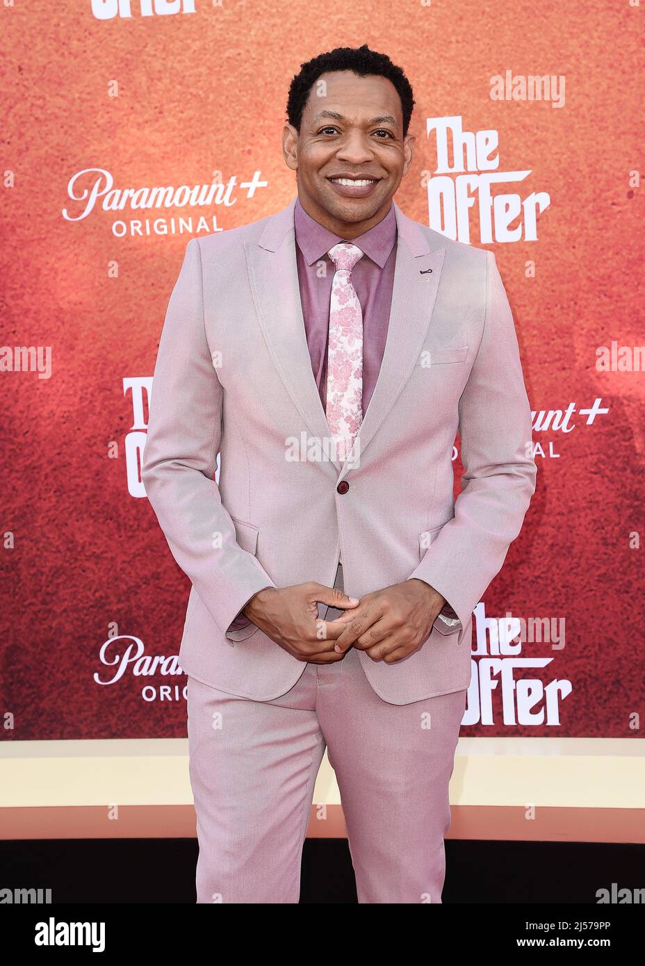 Derrick Baskin walking on the red carpet at the Los Angeles Premiere of ...