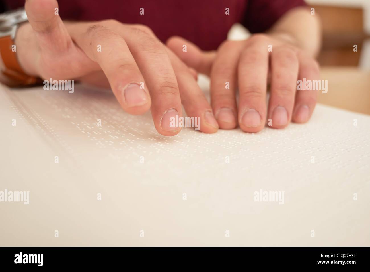 Visually impaired man reading a braille book Stock Photo - Alamy