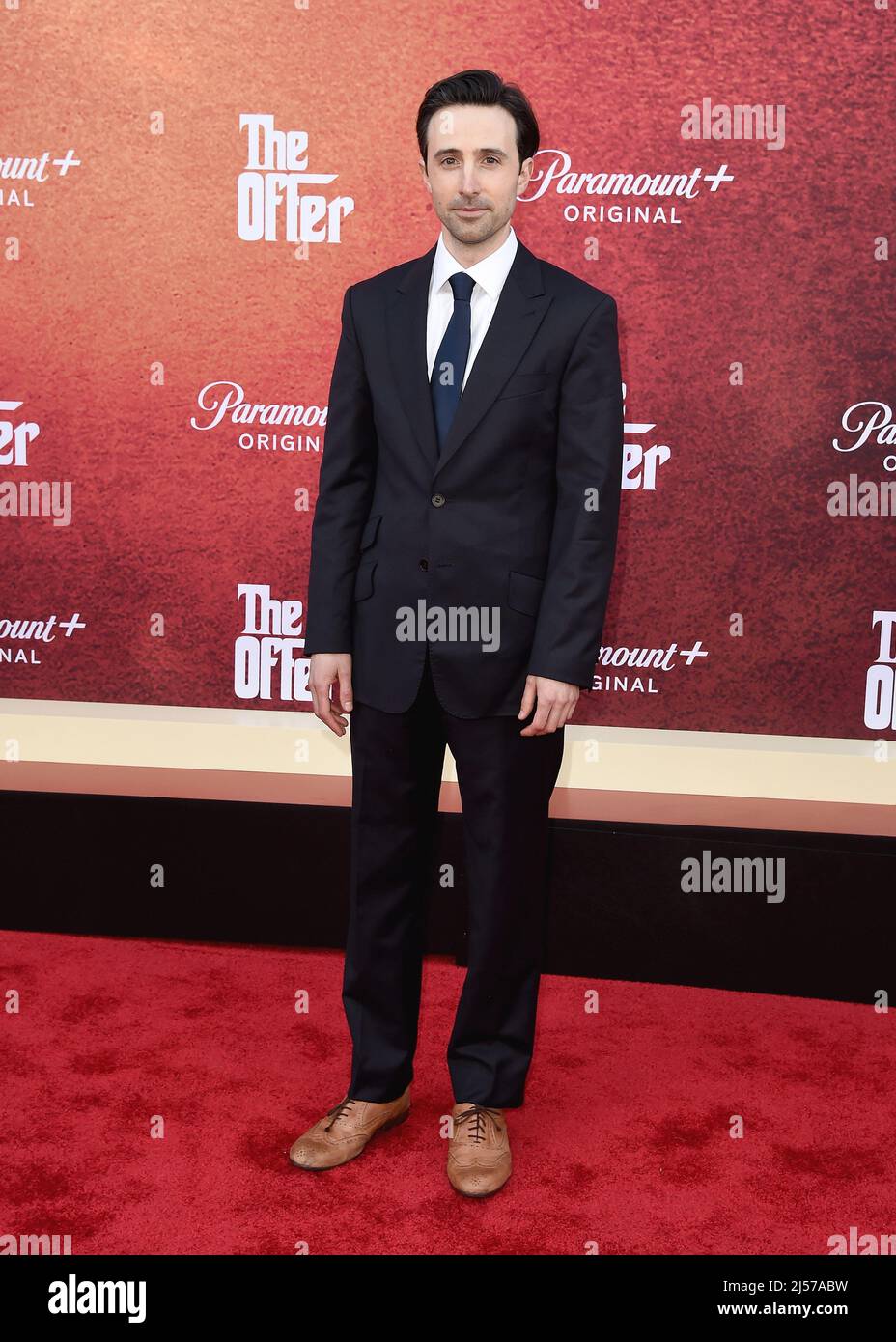 Josh Zuckerman walking on the red carpet at the Los Angeles Premiere of ...