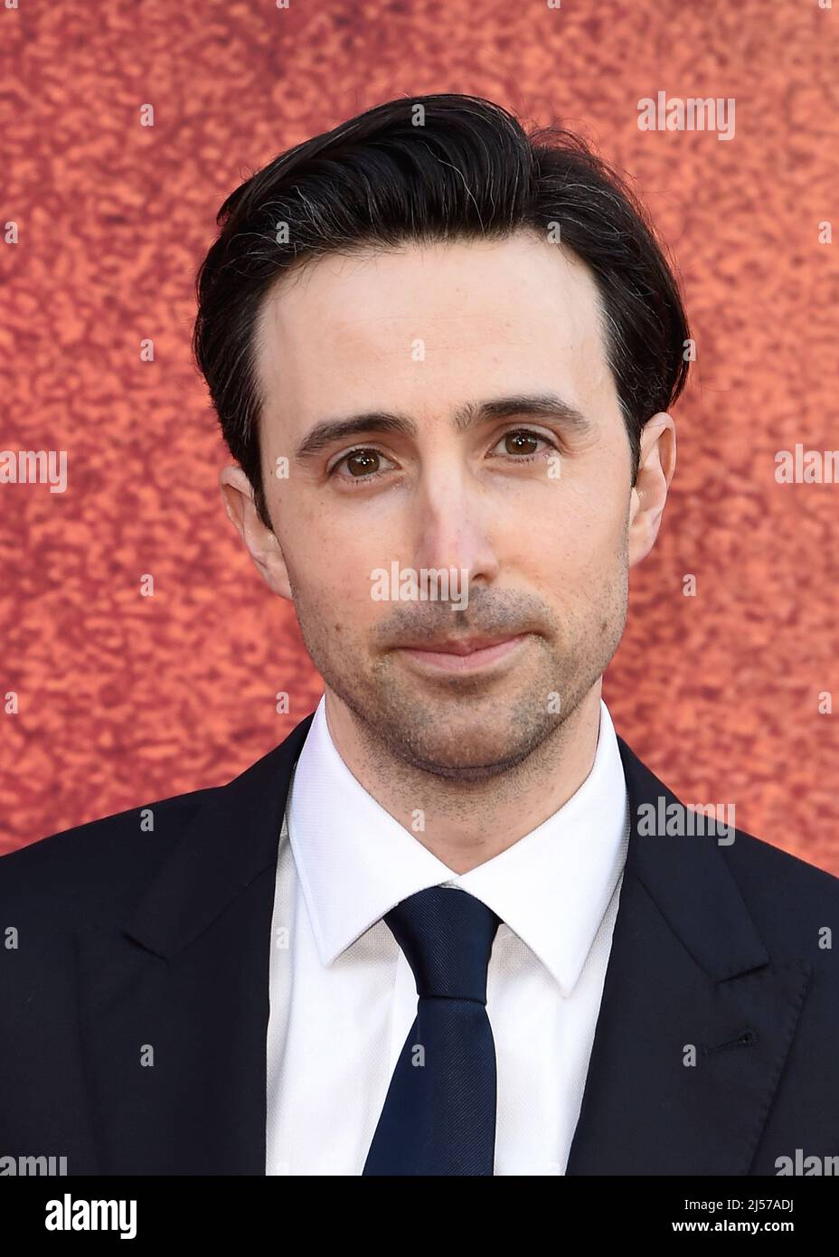 Josh Zuckerman walking on the red carpet at the Los Angeles Premiere of ...