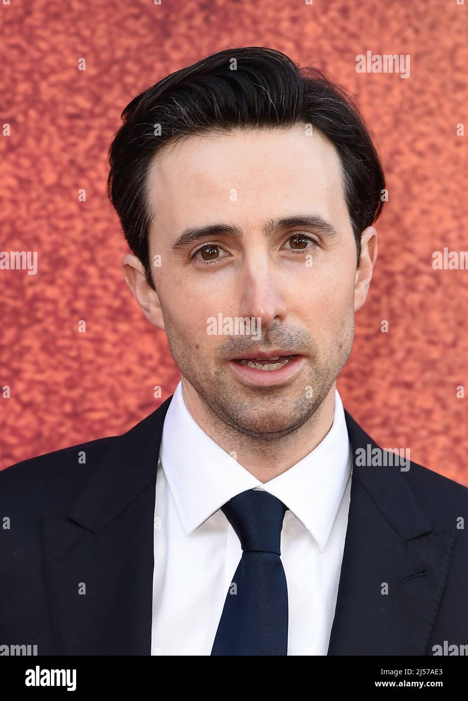 Josh Zuckerman walking on the red carpet at the Los Angeles Premiere of ...