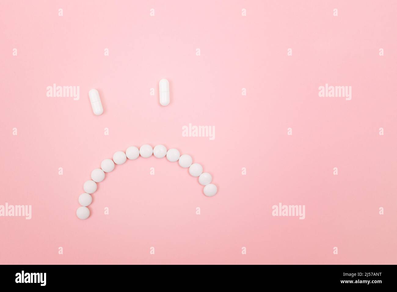 Pharma Harm. Sad Smiley Face Made from White Pills, Lying on Pink ...