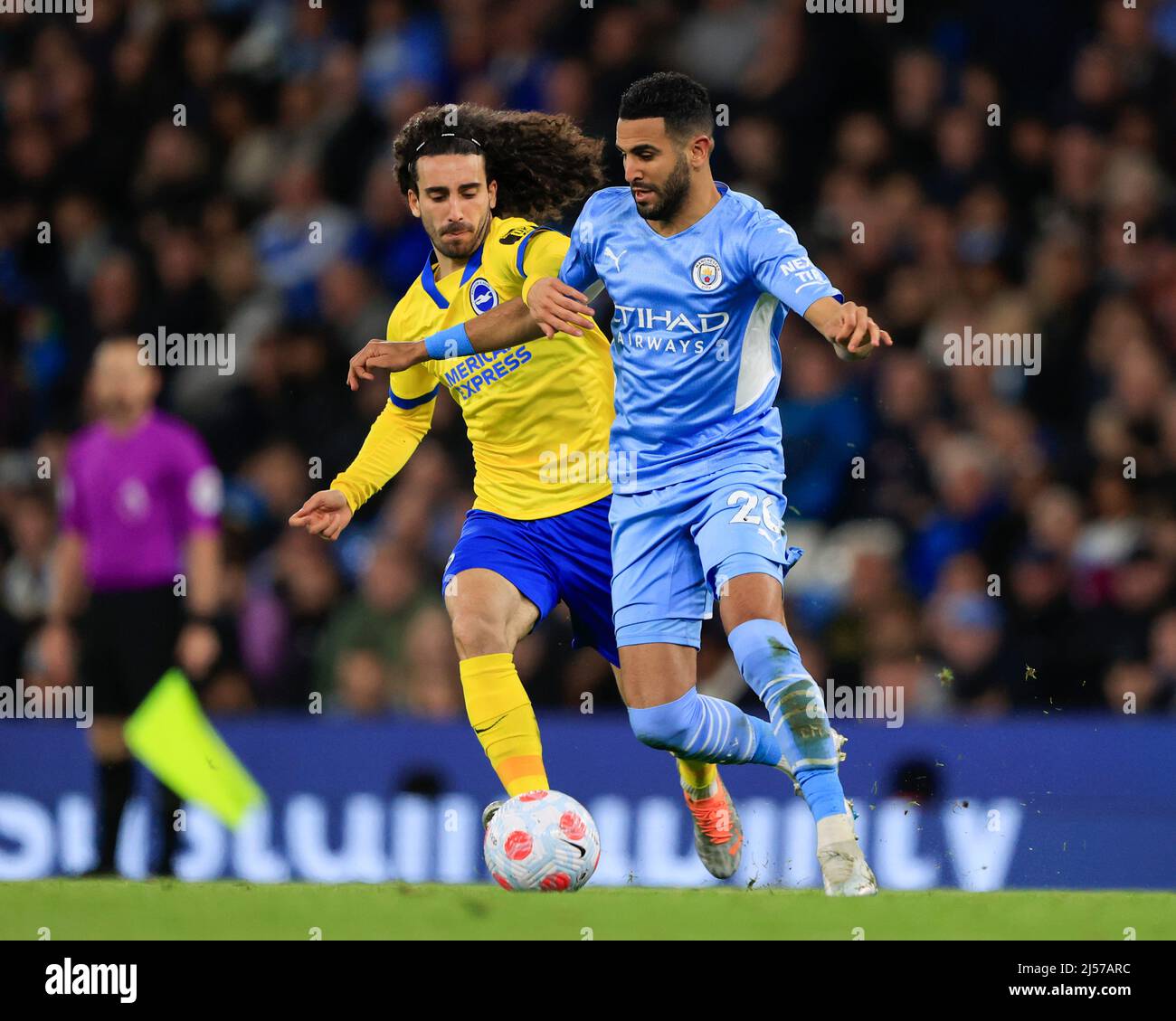 Riyad Mahrez #26 of Manchester City shields the ball from Marc ...