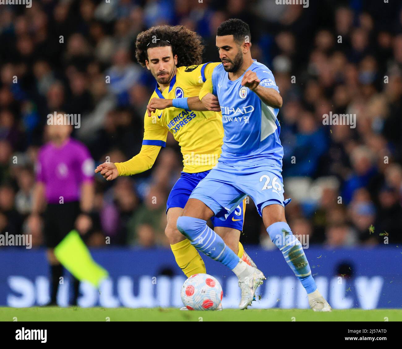 Riyad Mahrez #26 of Manchester City shields the ball from Marc ...