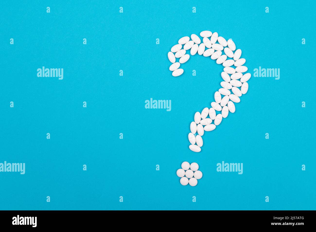 Question Mark Made from White Pills and Tablets, Lying on Blue ...