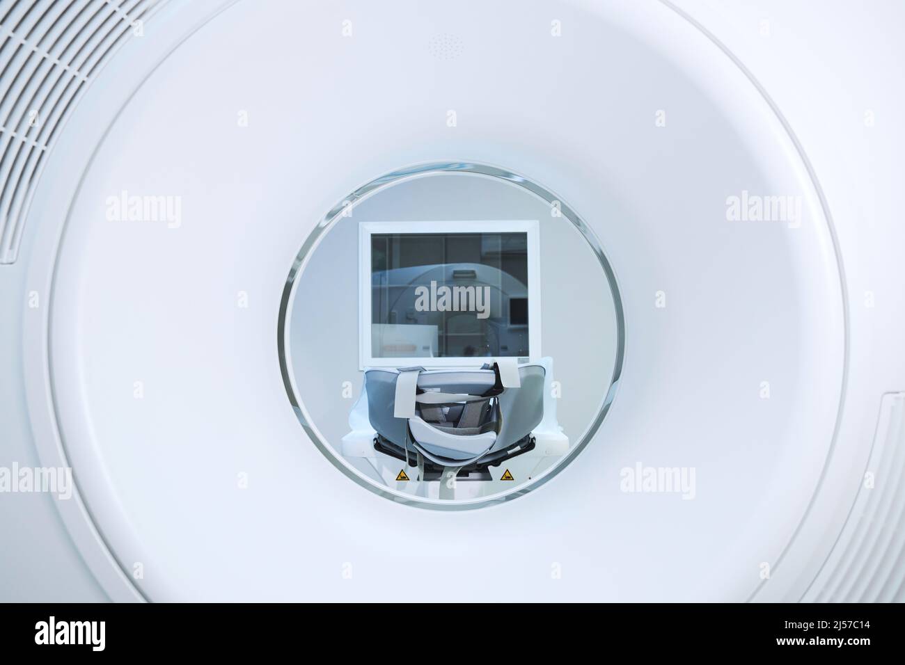 Bore view of modern MRI equipment with table and belts in clinic Stock ...