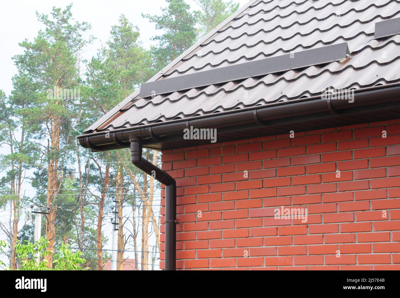 Roof gutter with metal snow board for snow protection. Metal roofing ...