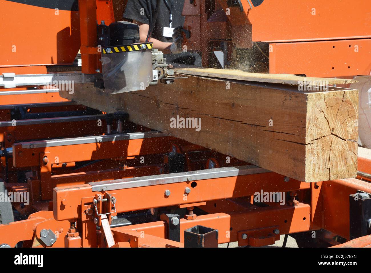Сircular saw with worker hands making a straight cut. Wood cutting ...