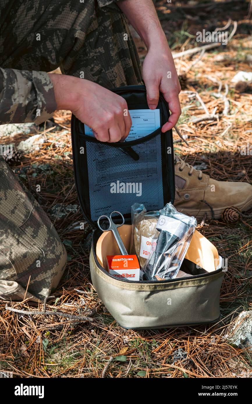 Military army first aid kit. Camouflaged soldier medic Stock Photo - Alamy