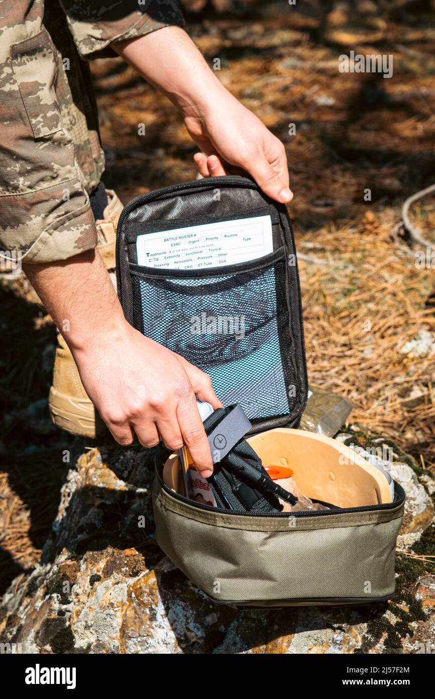 Military army first aid kit. Camouflaged soldier medic Stock Photo - Alamy