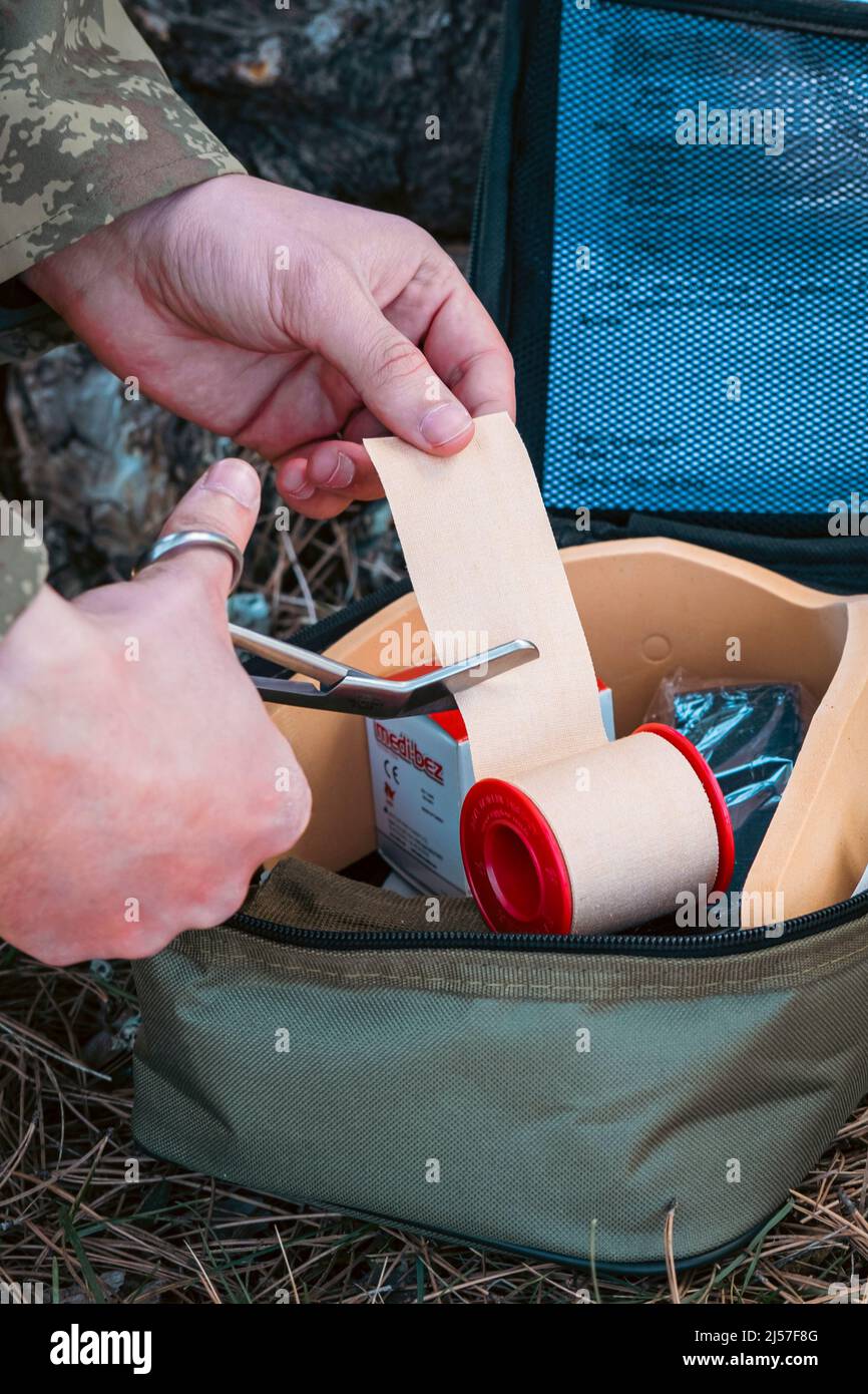Military army first aid kit. Camouflaged soldier medic Stock Photo - Alamy