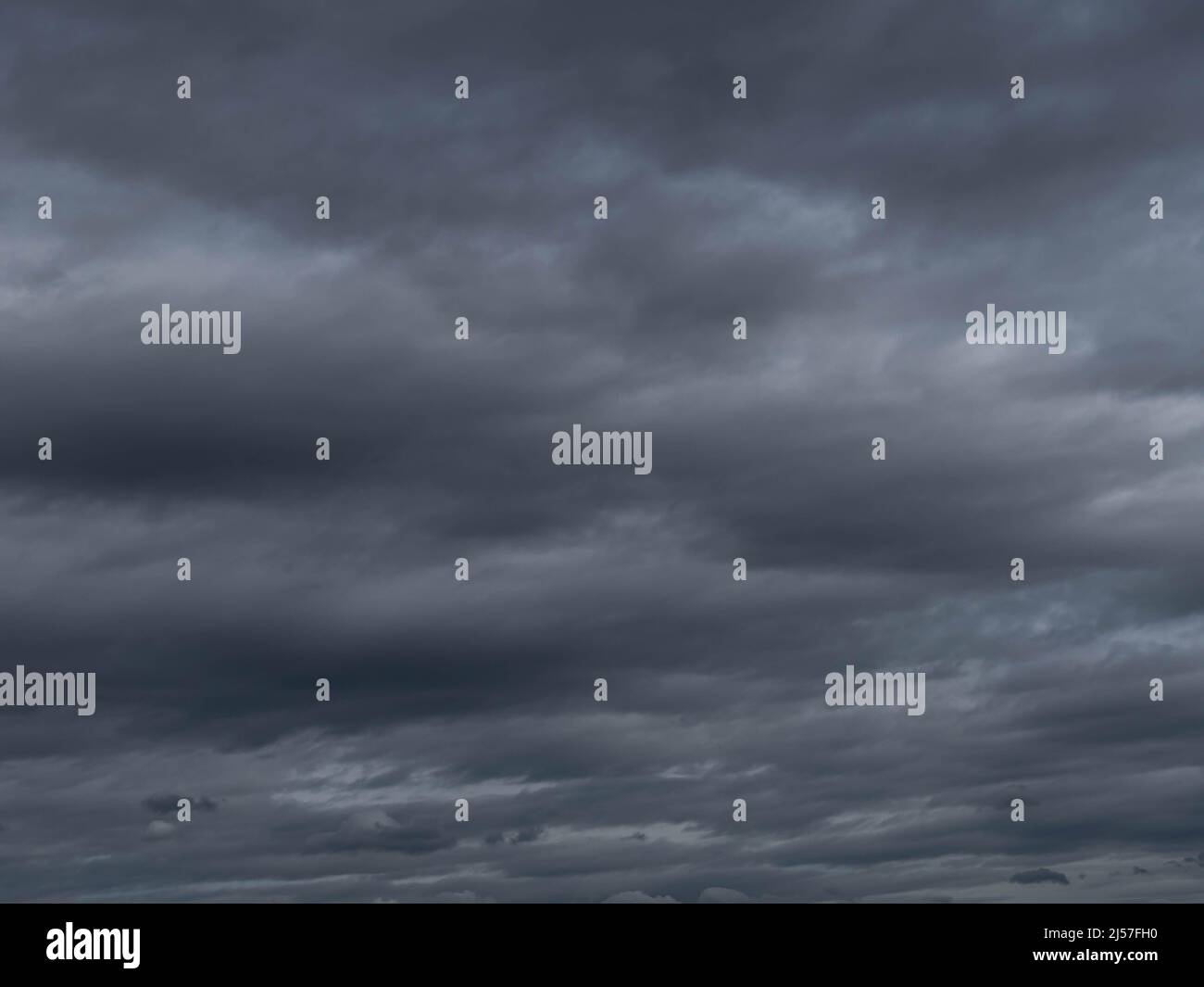 Clearly overcast skies. Dark, sinister clouds, dark blue in color ...