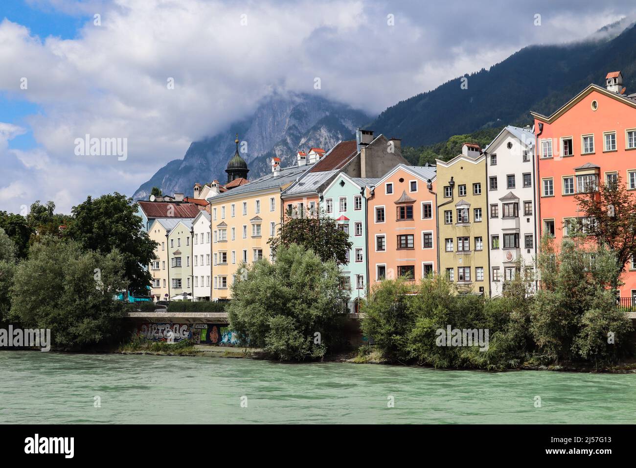 Innsbruck from the Inn River with Colorful Buildings and Mountains ...