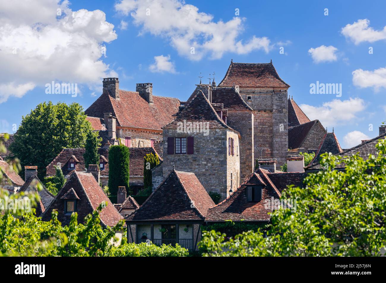 Neat medieval brick buildings with sloping tiled roofs of antique ...