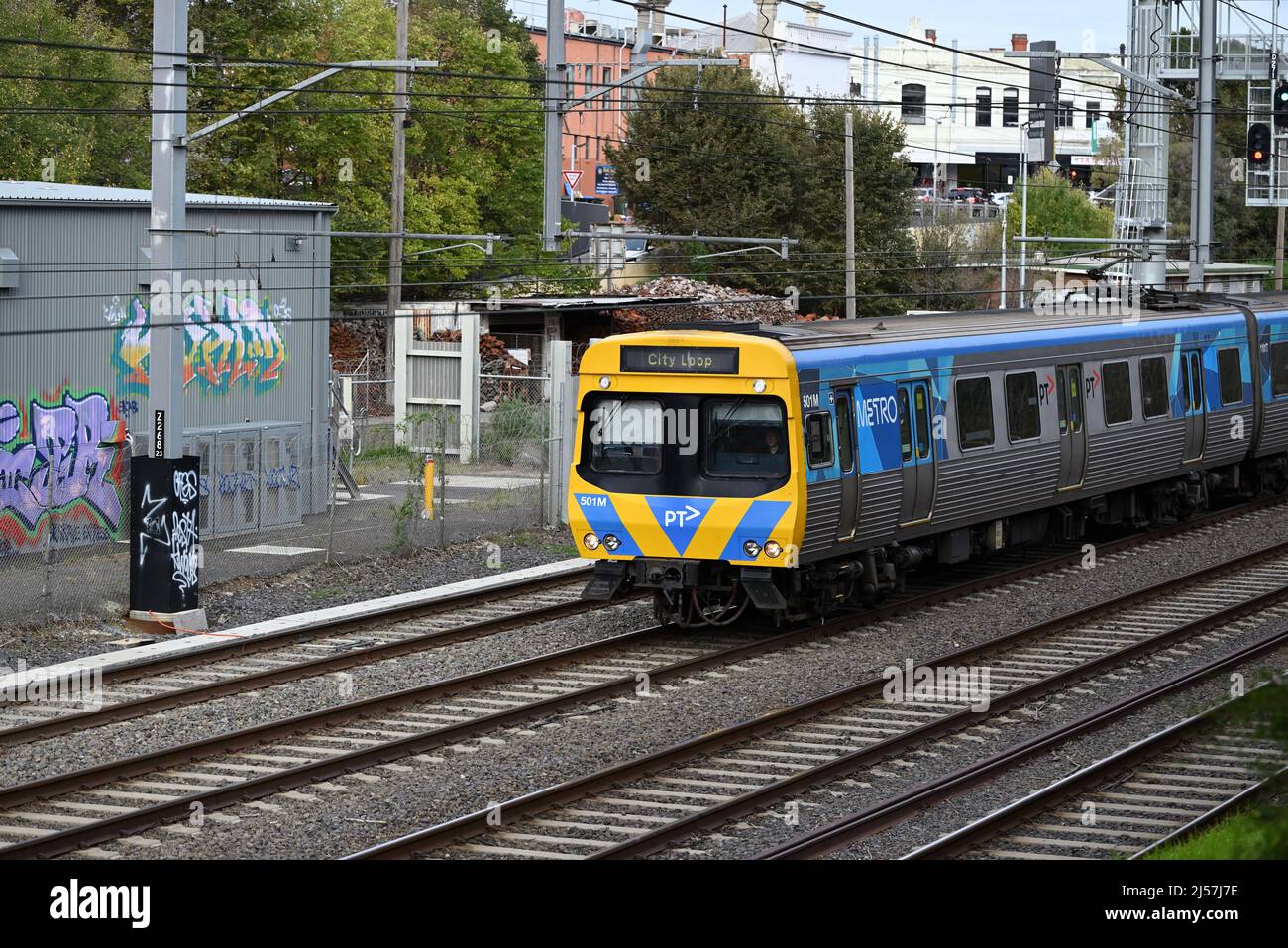 Comeng train, featuring current PTV livery, passing through one of ...