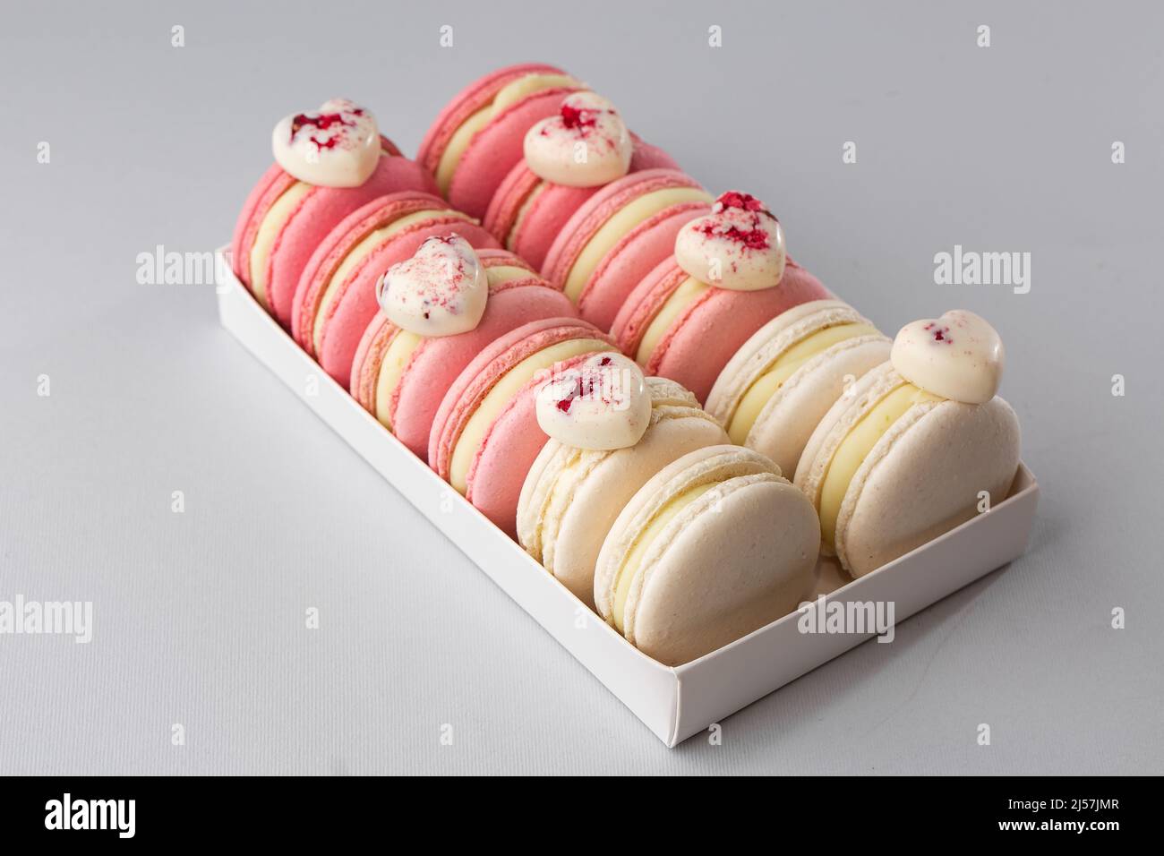 French macarons. Beautiful macaroons with heart decoration. Stylish ...