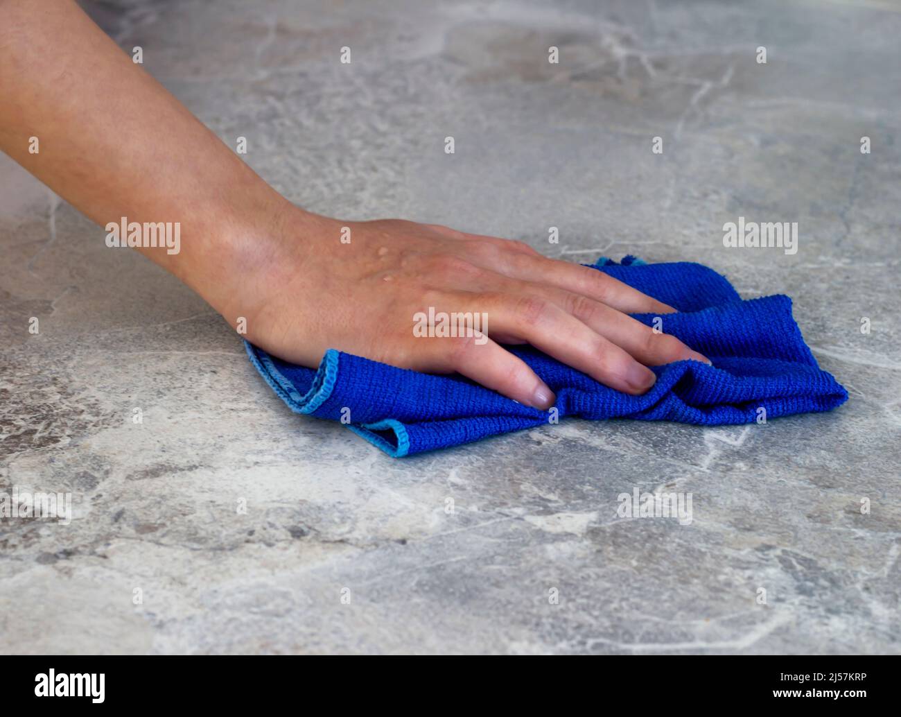 Woman cleaning the table after dinner with a microfiber cloth Stock ...