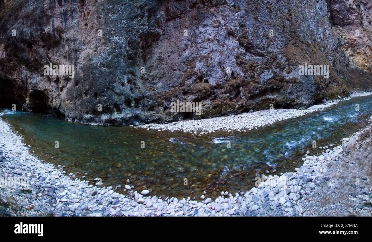 Mountain defile, scarp with traces of water erosion. The turn of a ...