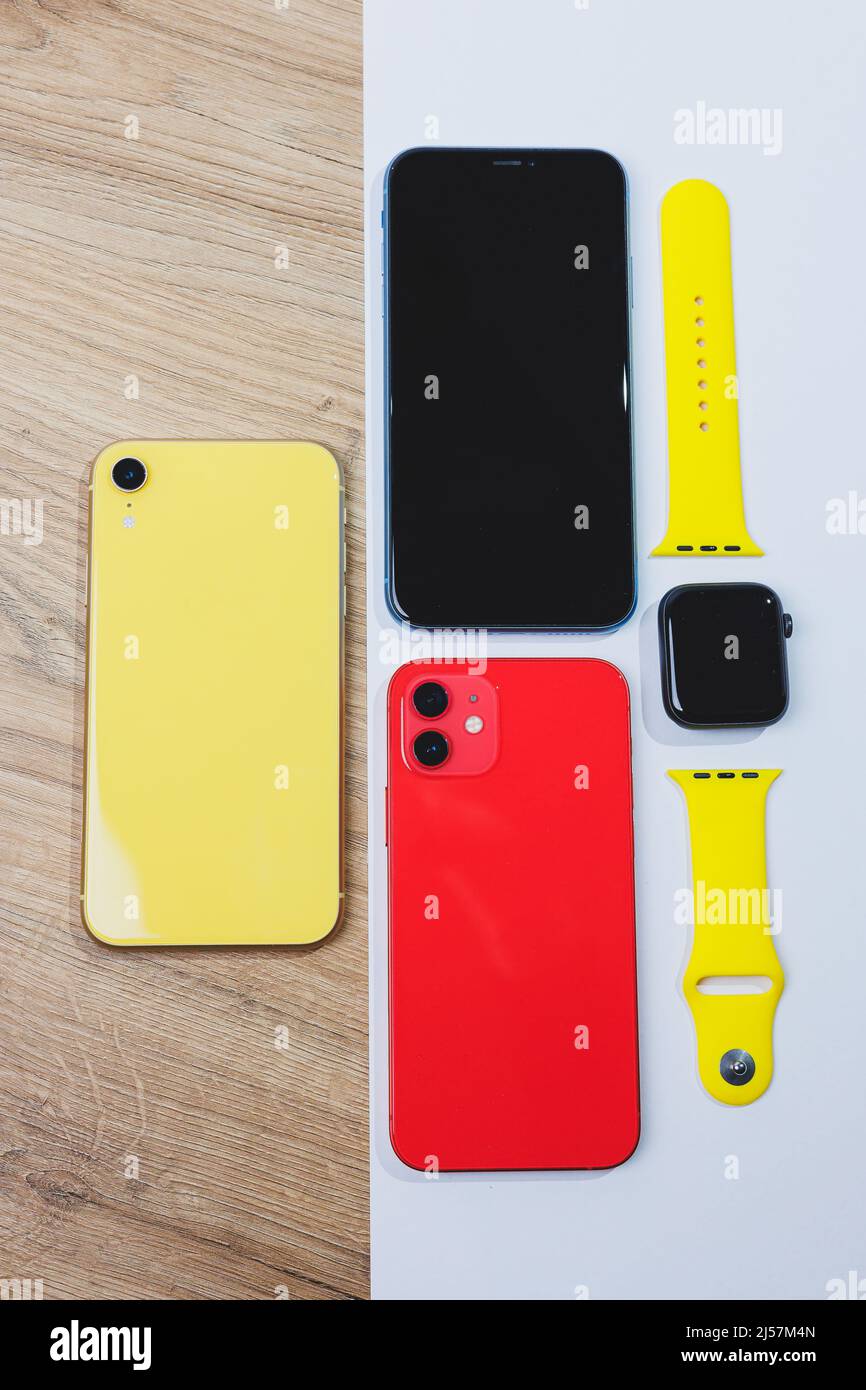 Smartphone and smart watch are on the table. Nearby are straps for ...