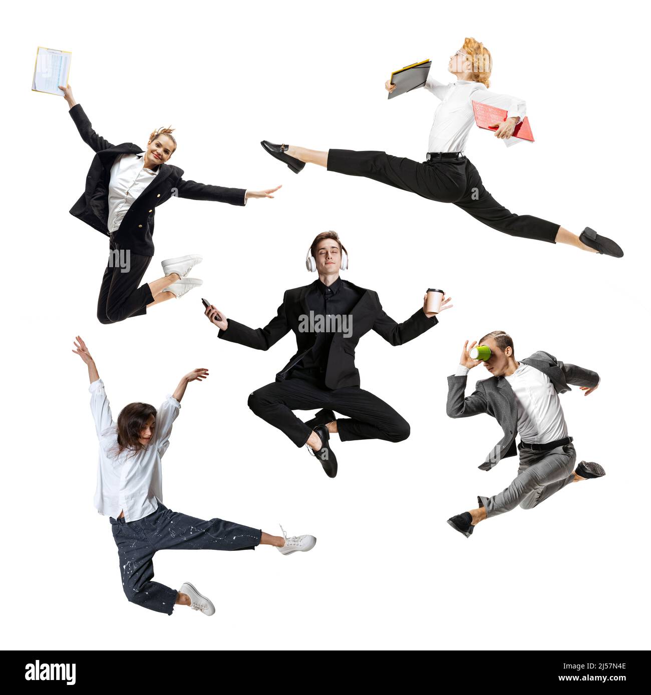 Young office workers jumping and dancing in busness style clothes or ...