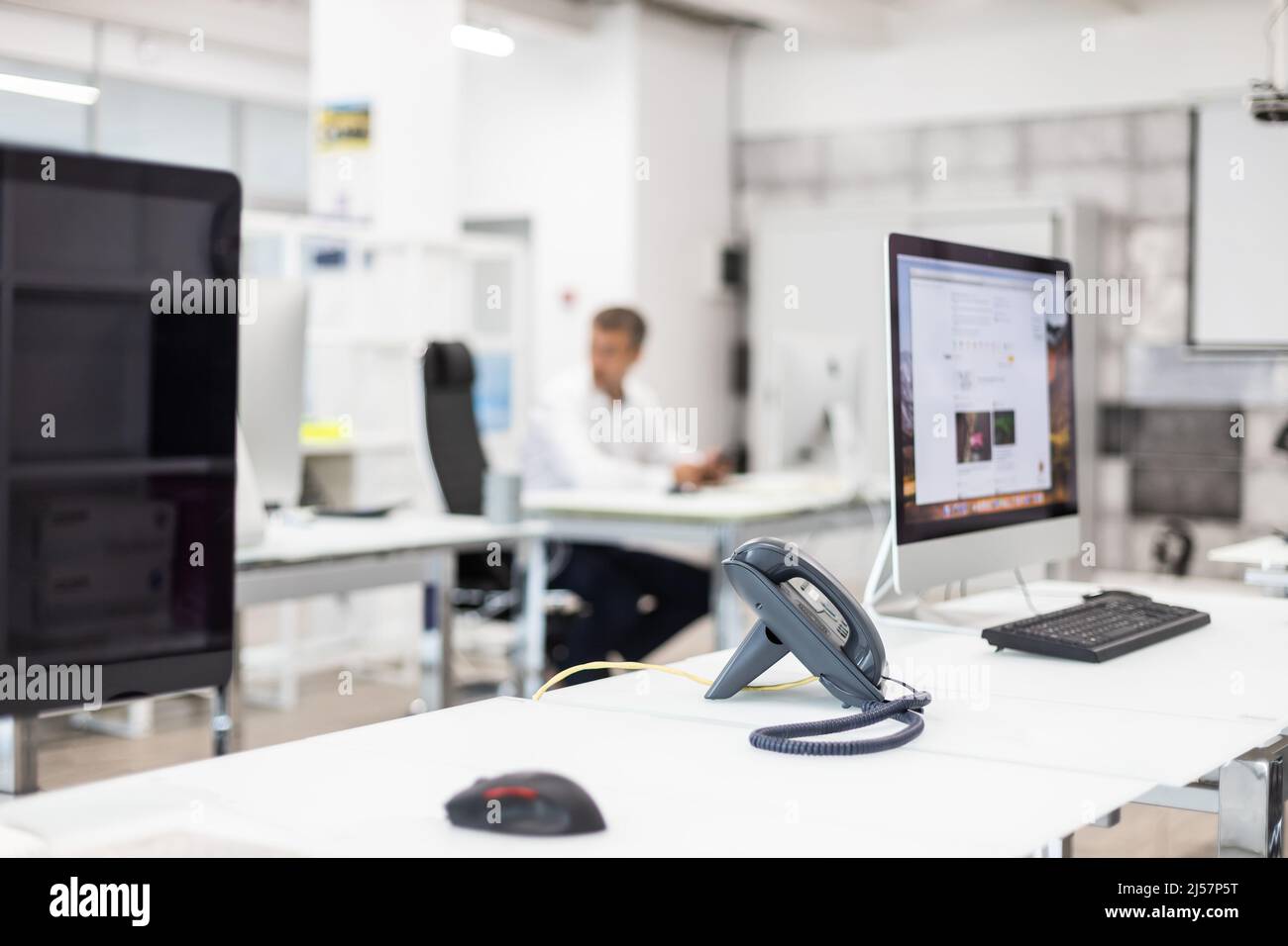 Interior of a modern light small company office. Workspace, office ...
