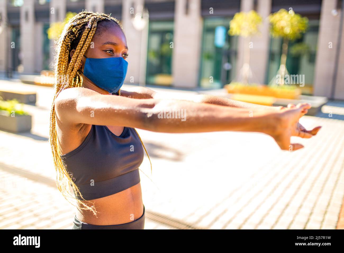 african american woman with long yellow dreadlocks pigtails working out ...