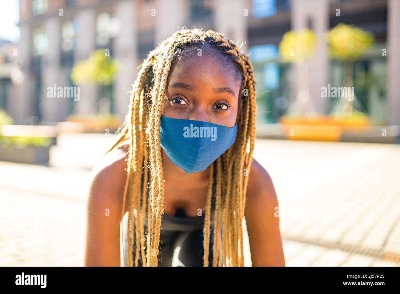 african american woman with long yellow dreadlocks pigtails working out ...