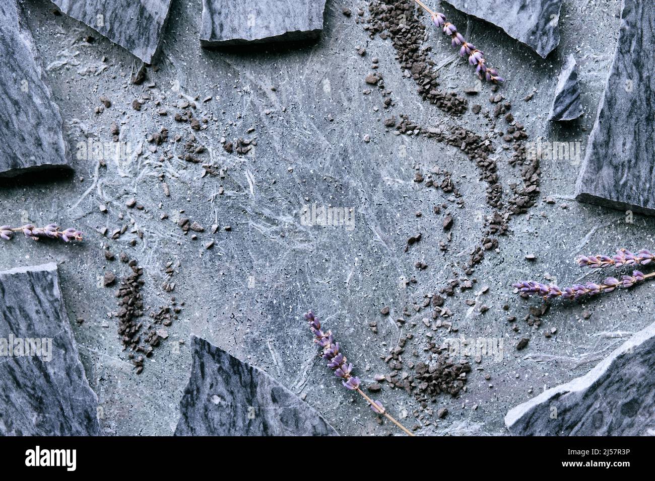 Layered flat stone background with broken pieces of granite plate and ...