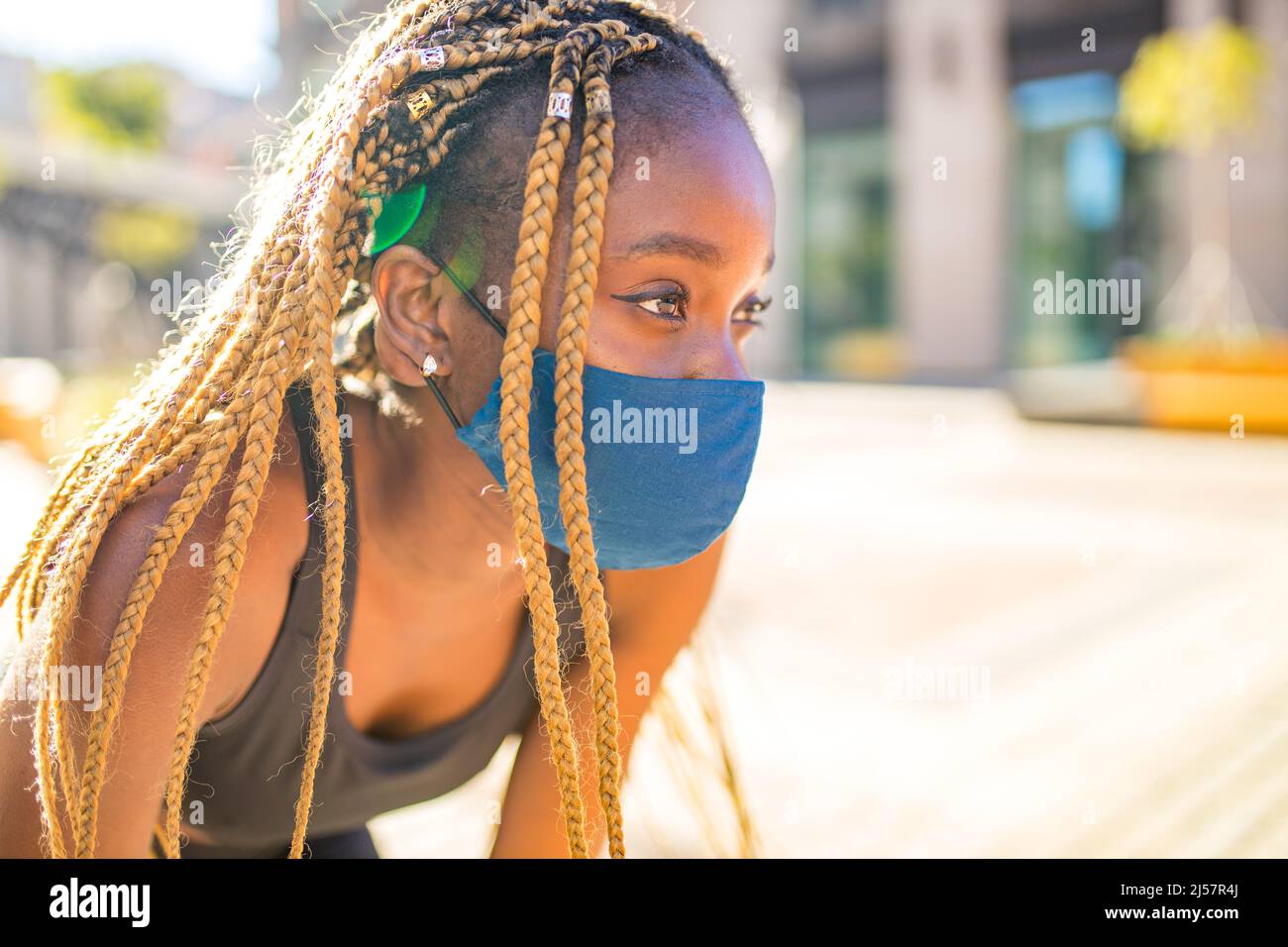 african american woman with long yellow dreadlocks pigtails working out ...
