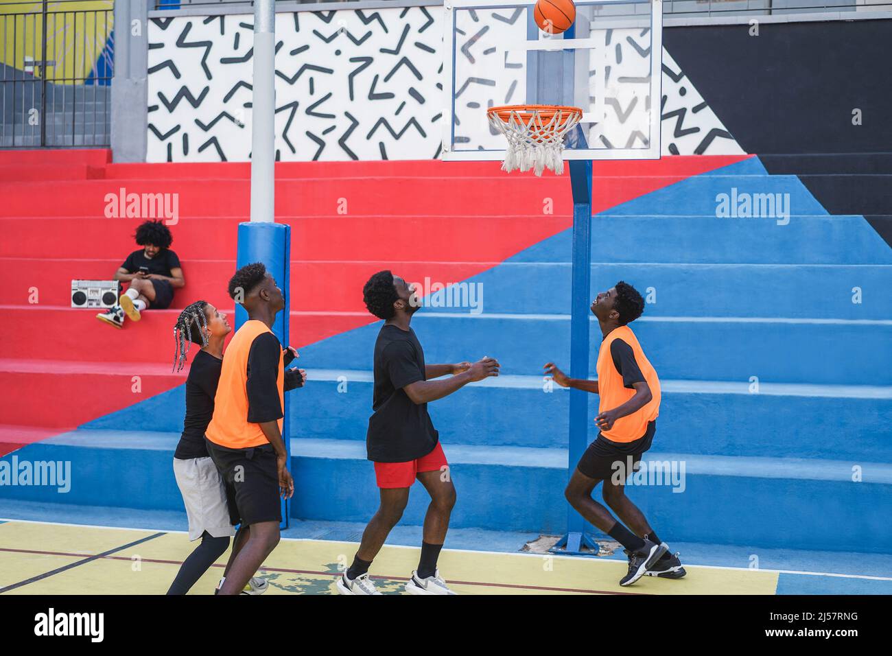 African friends playing basketball outdoor - Focus on faces Stock Photo ...