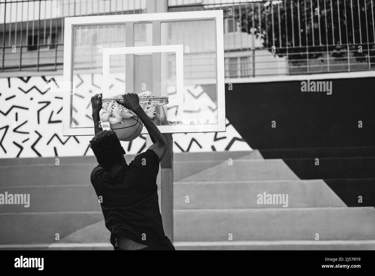Young african man playing basketball outdoor - Focus on hands holding ...