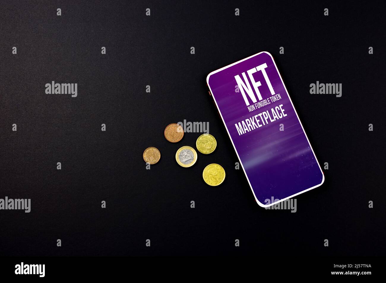 Smartphone with a yellow background with a wallpaper of an NFT ...