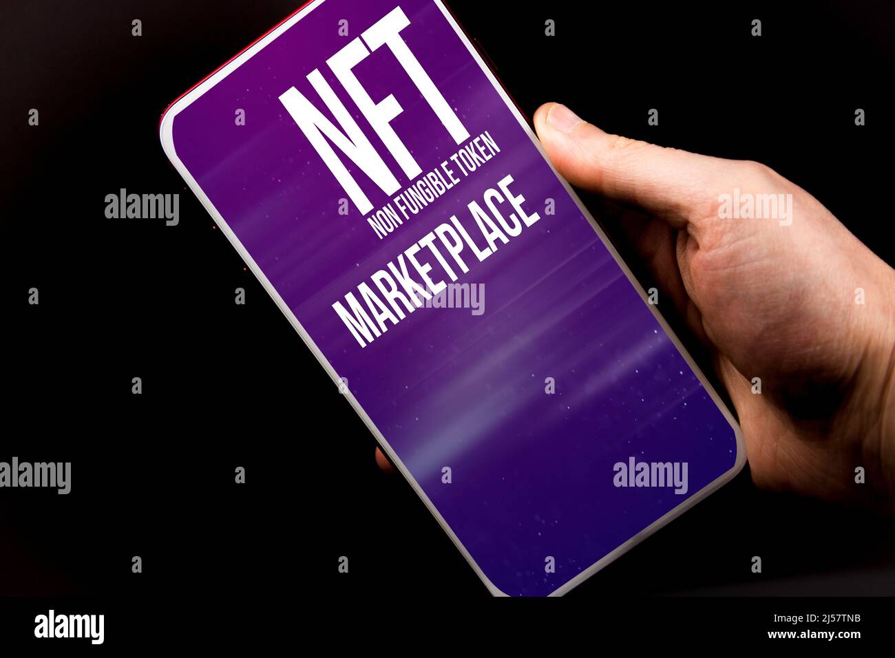 Smartphone with a yellow background with a wallpaper of an NFT ...