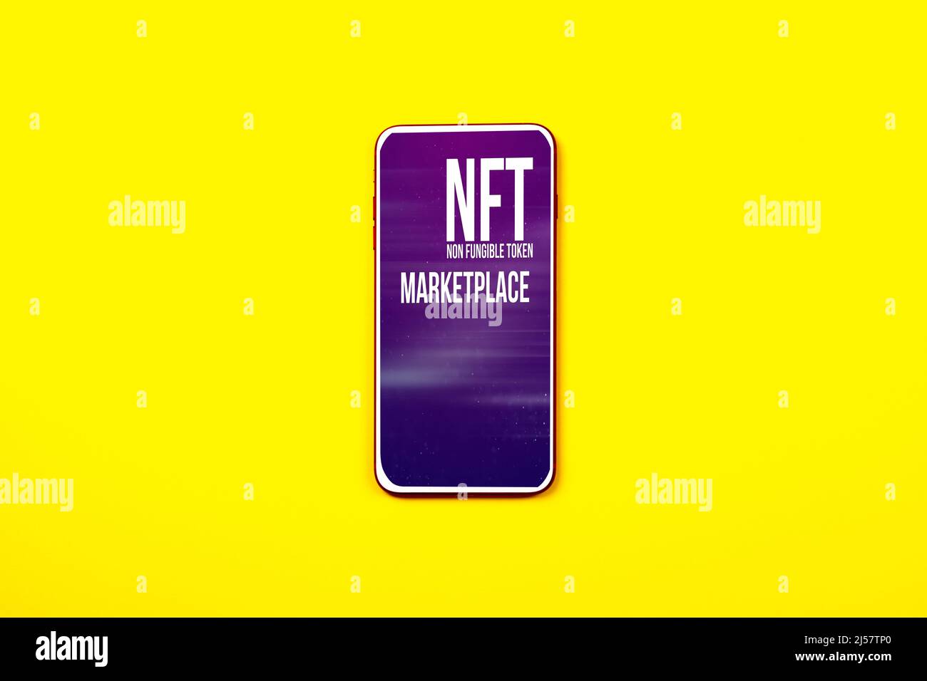 Smartphone with a yellow background with a wallpaper of an NFT ...