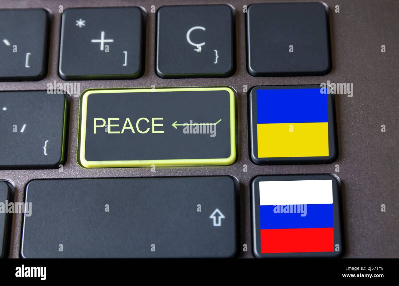 peace written on enter key with ukrainian and russian flag on other ...