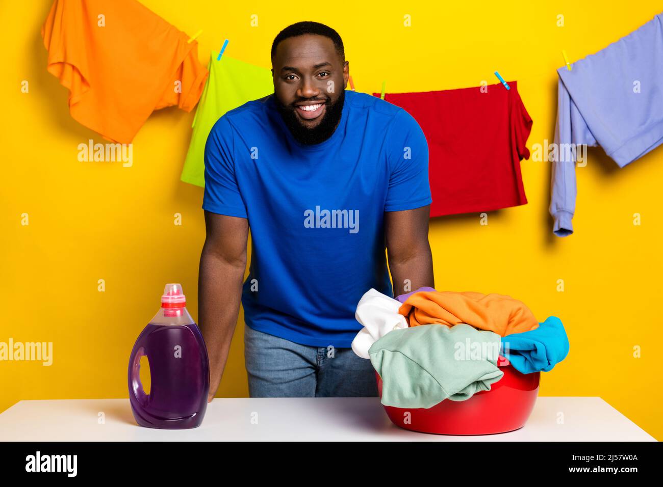 Portrait of handsome trendy cheerful guy washing wear garment soft ...