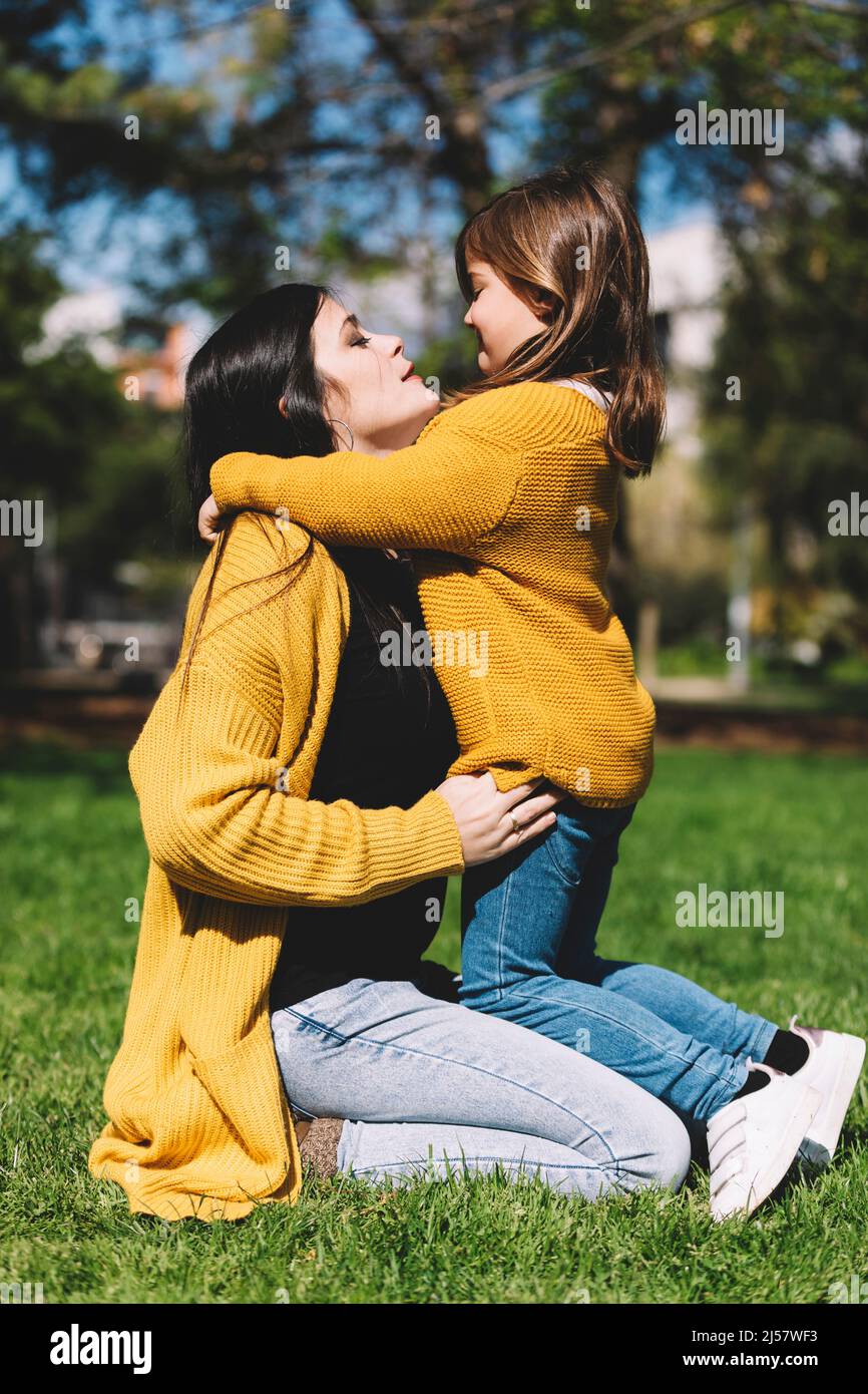 Little cute child baby girl kiss on cheek and hug, embrace with happy ...