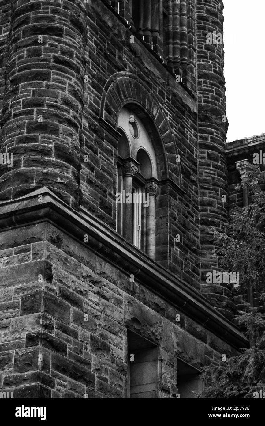Vintage stone tower in the medieval Gothic style in black and white ...