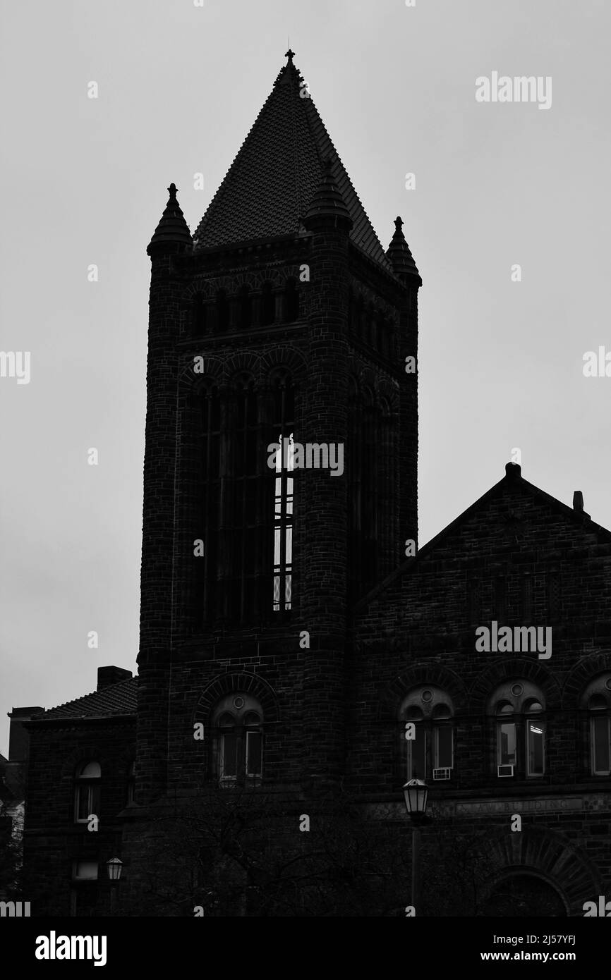 Vintage stone tower in the medieval Gothic style in high contrast black ...