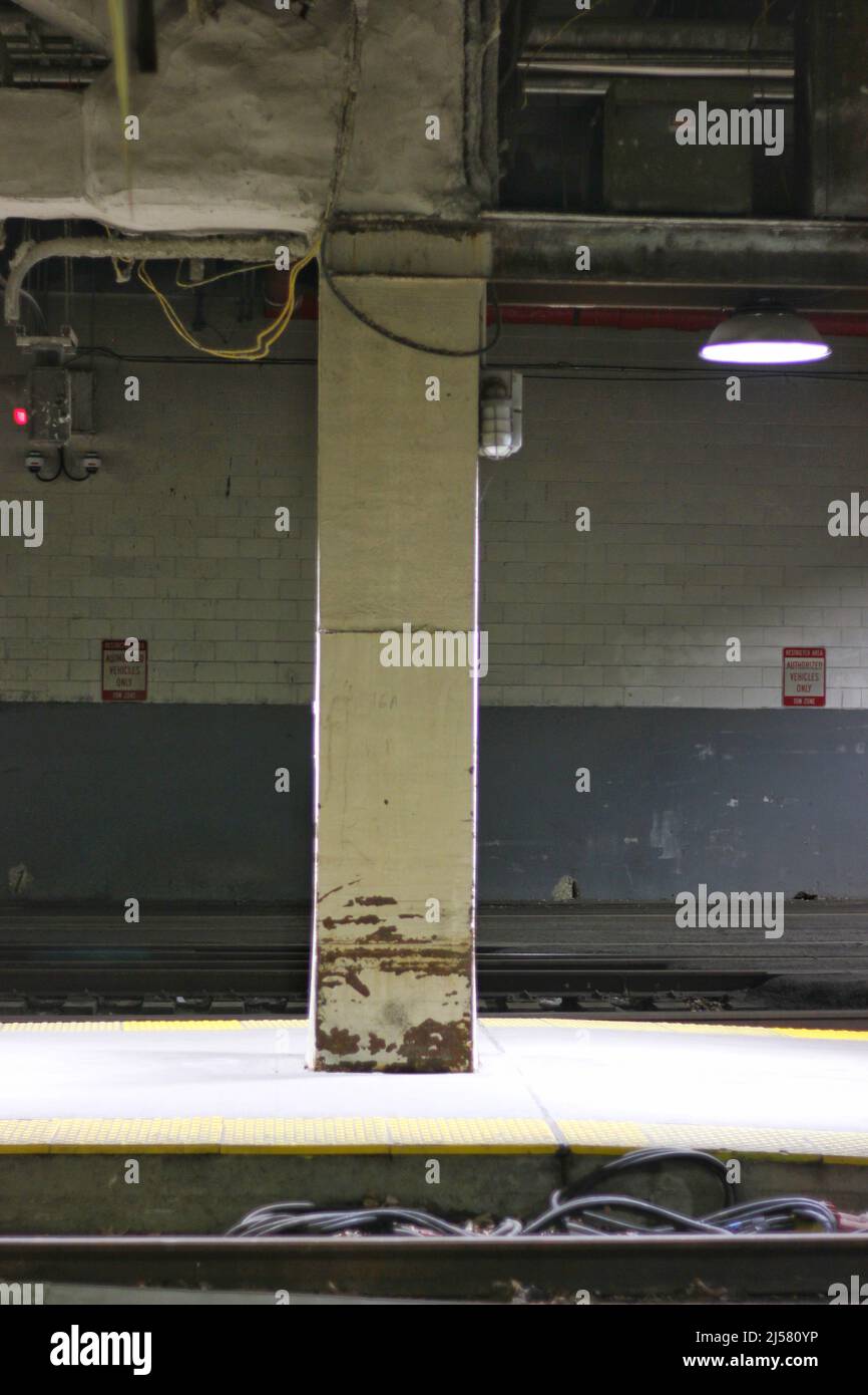 Simple foundation column standing on the public train platform in the ...