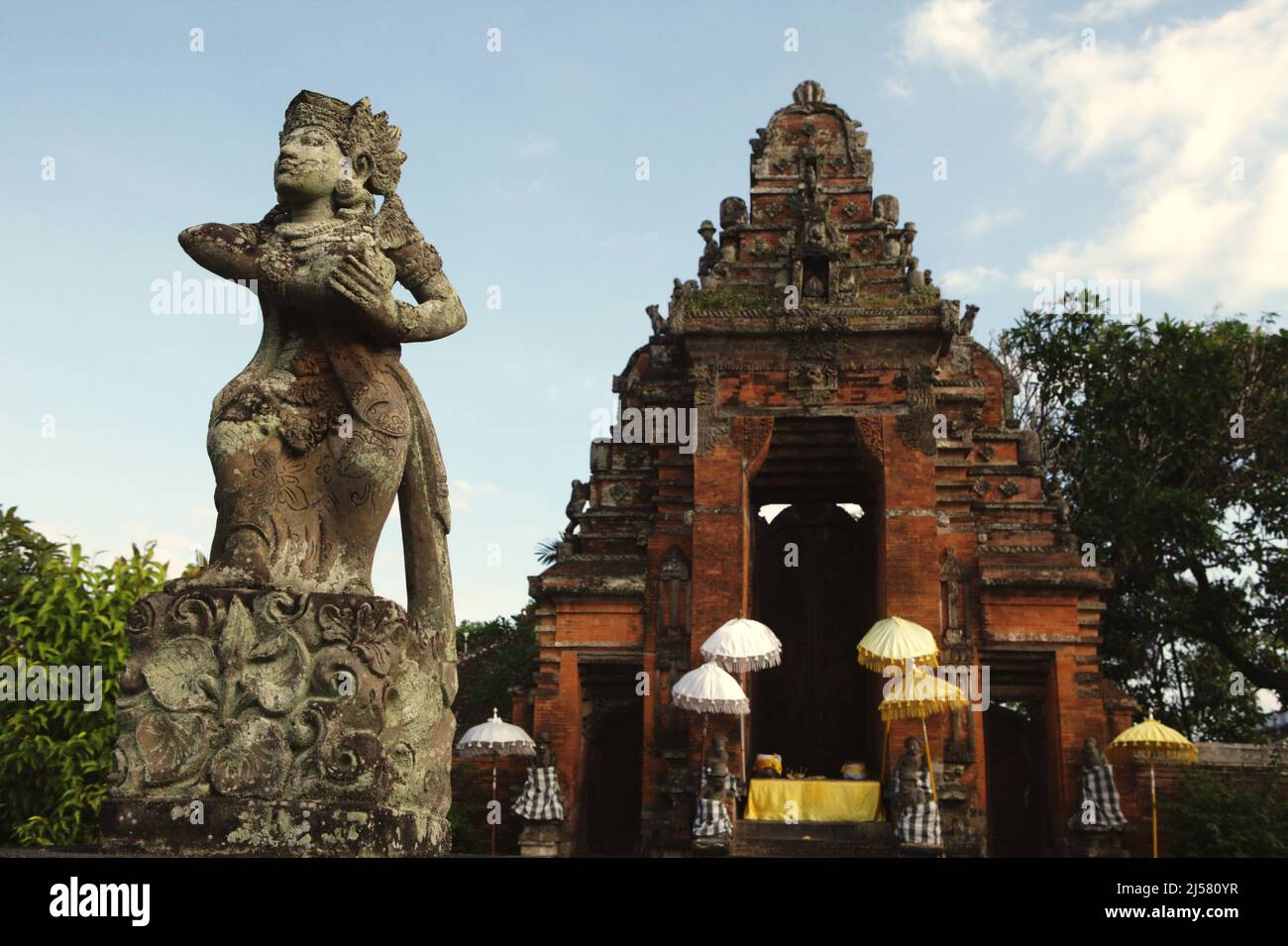 Balinese sculpture and a shrine near Kertha Gosa Pavilion (Bale Kambang ...
