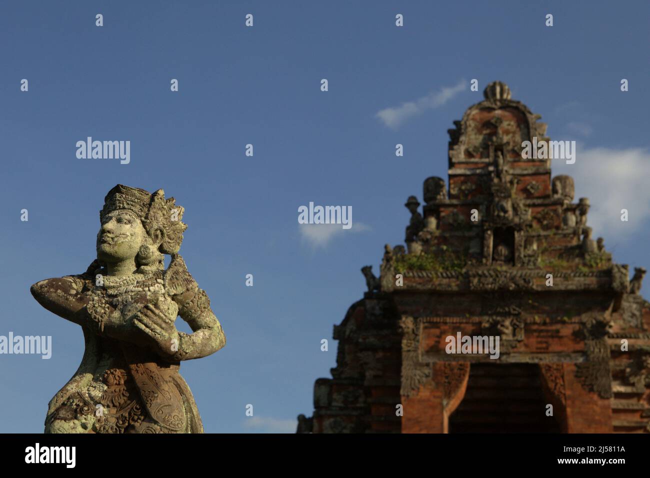 Balinese sculpture and a shrine near Kertha Gosa Pavilion (Bale Kambang ...