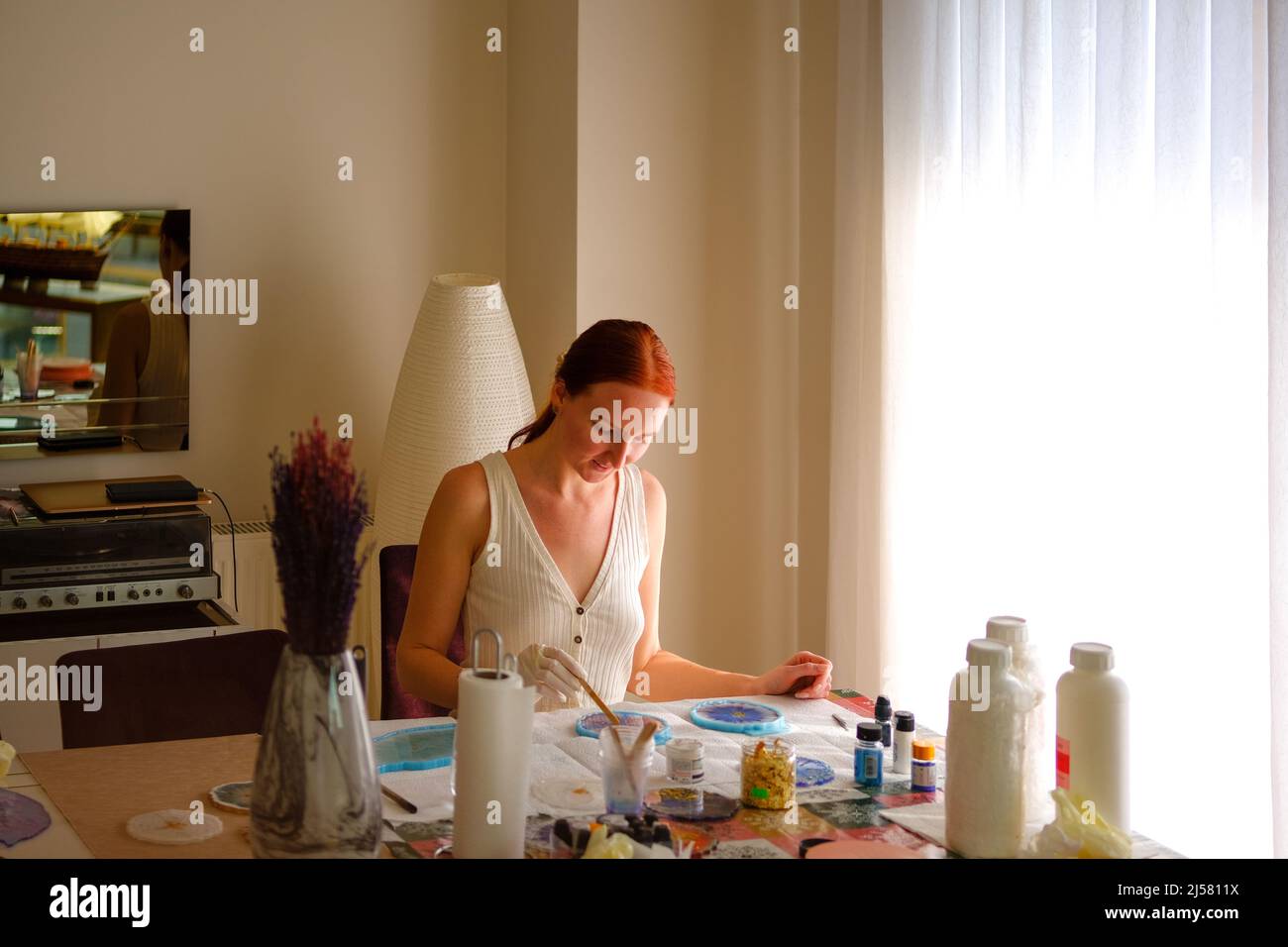 Woman making epoxy resin arts and crafts Stock Photo - Alamy