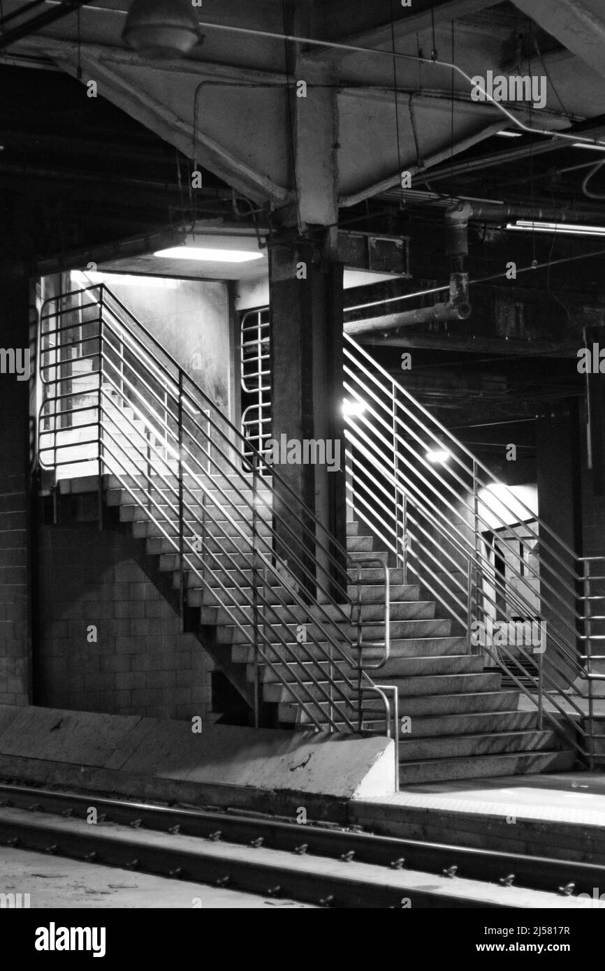 Public stairs going up to the upper level from the train station ...