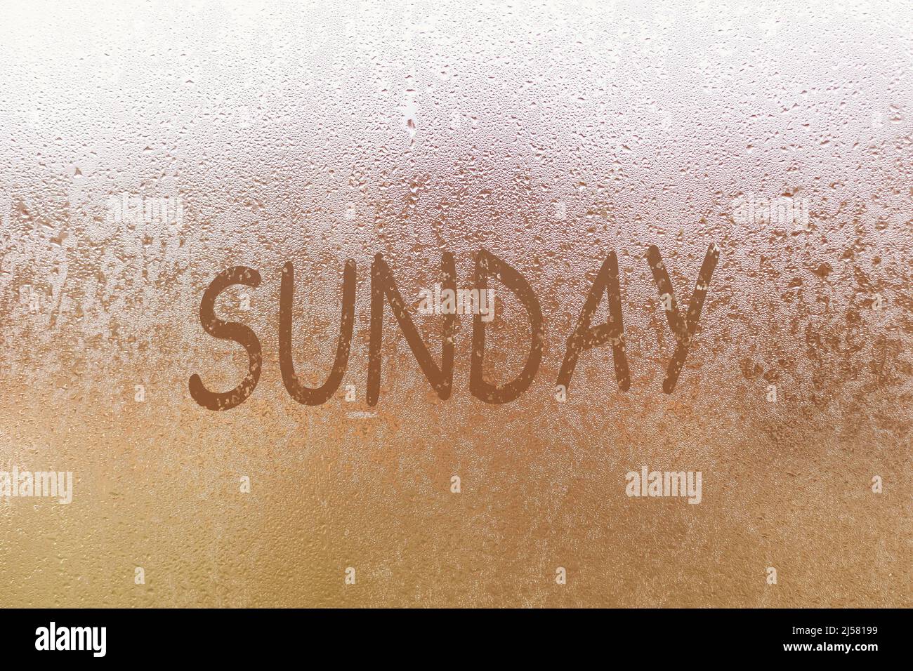 sunday written on the glass screen with raindrops background Stock ...