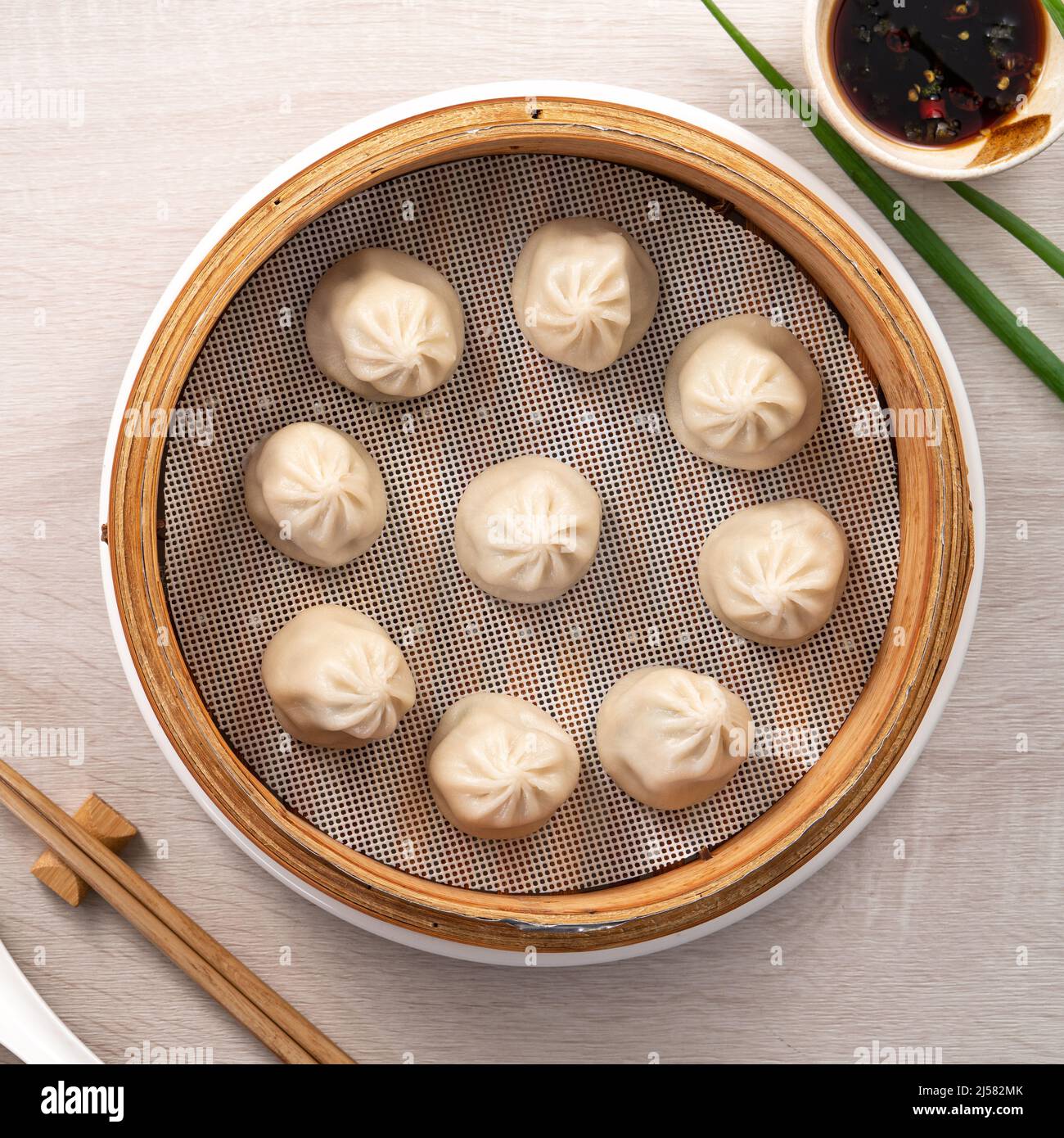 Eating steamed pork soup dumplings named Xiao long bao xiaolongbao in ...